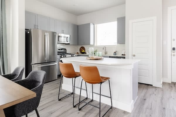 16 Ideas for Kitchen Islands With Seating, Designers Explain - Parade Home & Garden